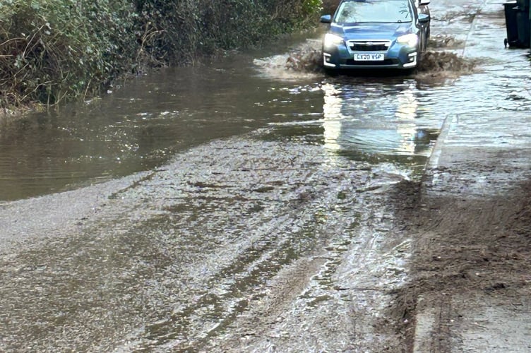 Drivers battle through the ‘Bramshott Sea’ on Church Road ...